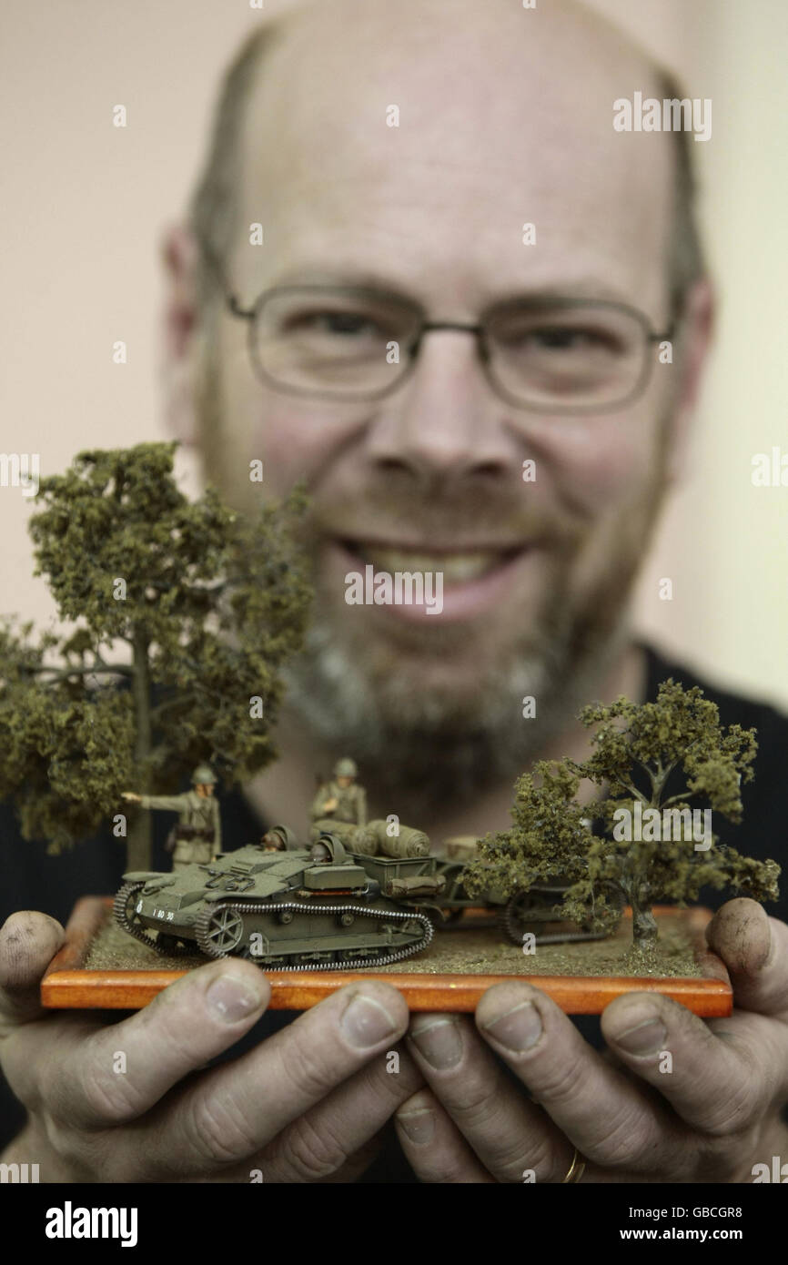 Model maker Martin Humphrey from Staines holds his scale model scene of ...