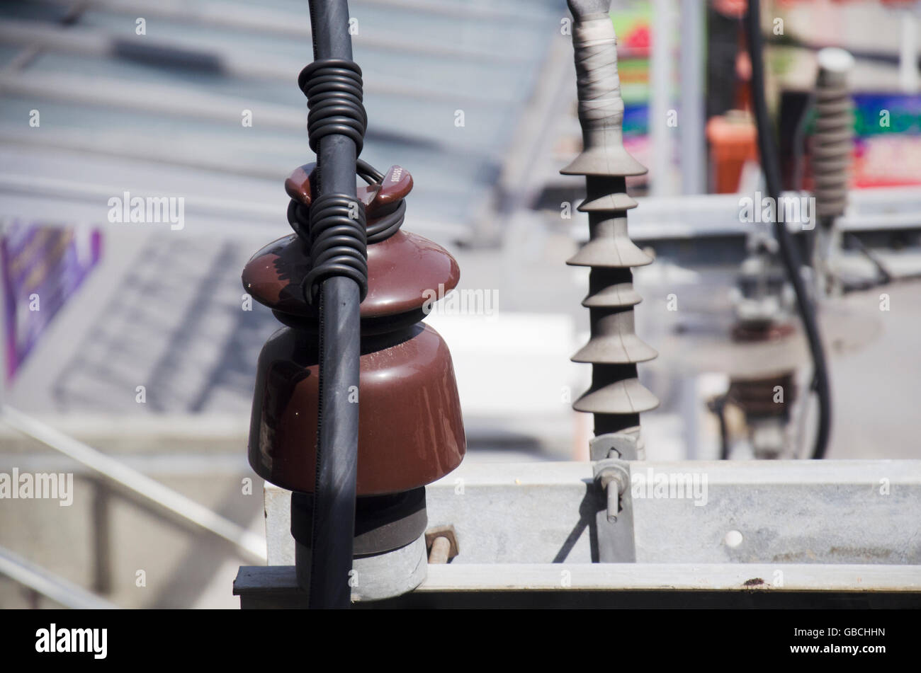 Insulator on electricity pillar or Utility pole at beside road in ...