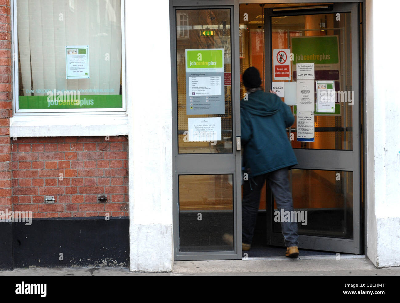 A man enters a Job Centre Plus in Westminster, London, as record ...