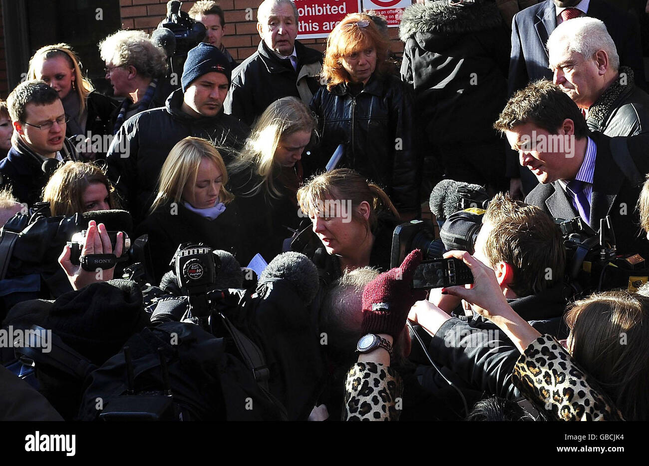 Julie Bushby (centre), friend and neighbour of Karen Matthews, talks to ...