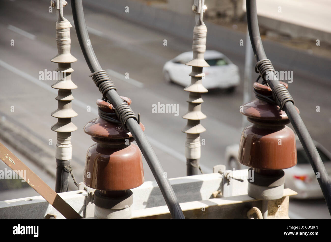 Insulator on electricity pillar or Utility pole at beside road in ...