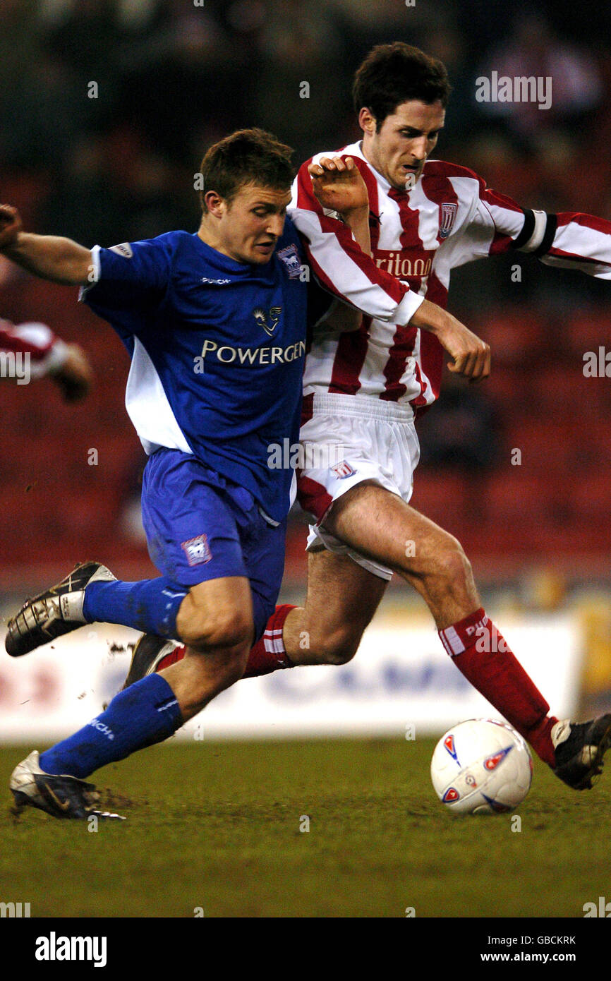 Stoke City's Clive Clarke battles for possession of the ball with ...