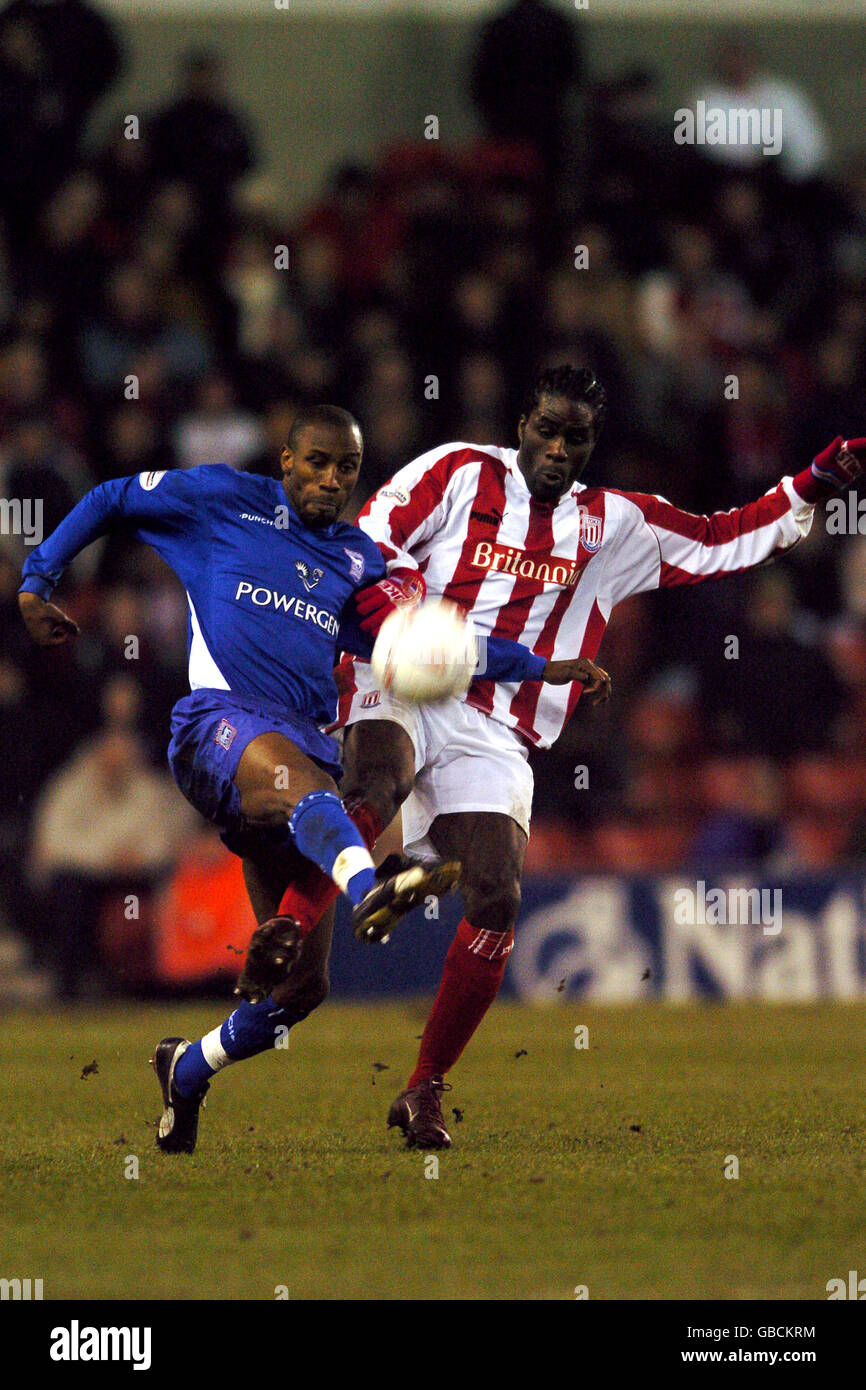 Stoke City's Ade Akinbiyi battles for possession of the ball with ...