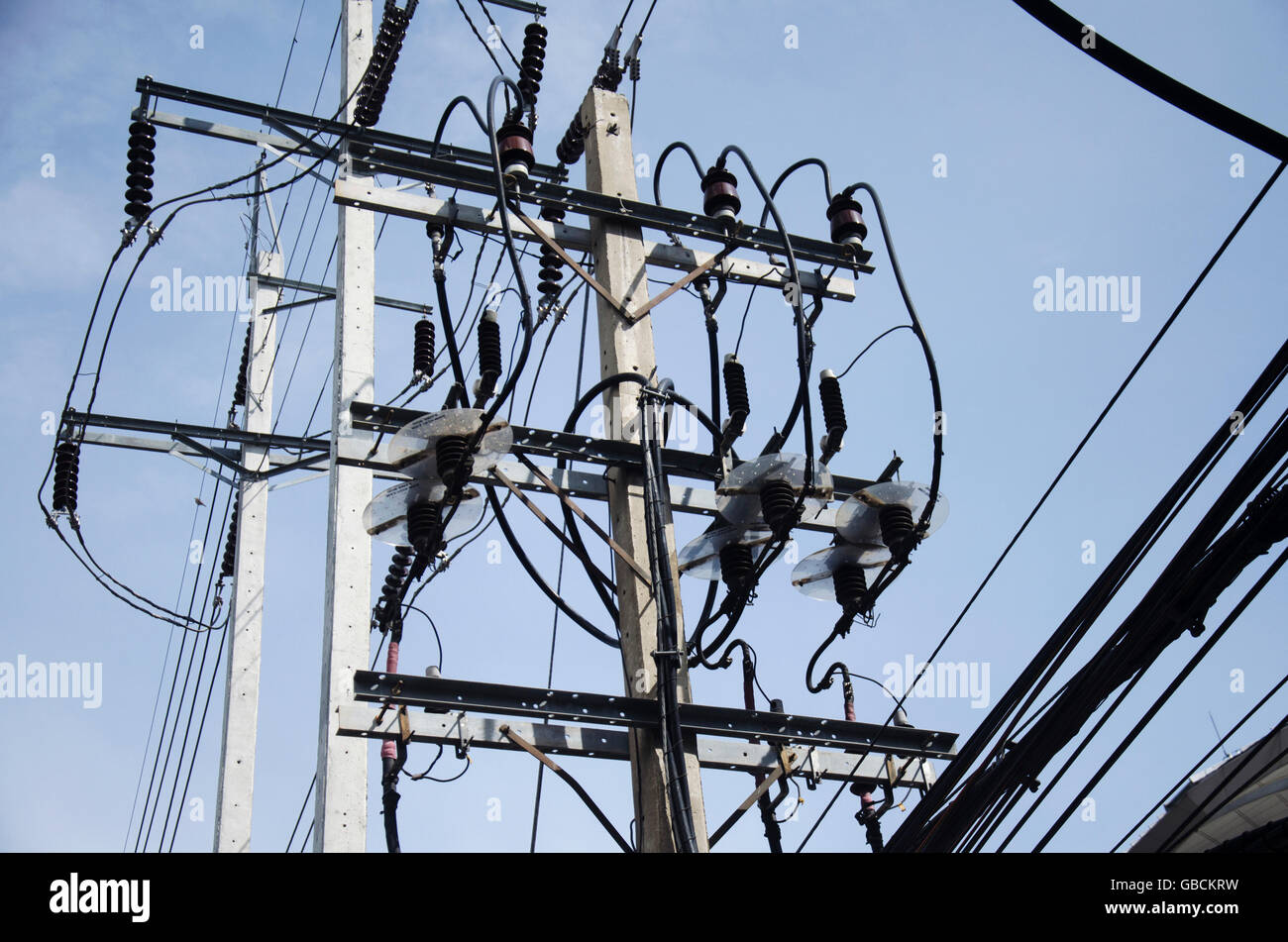 Insulator on electricity pillar or Utility pole at beside road in ...