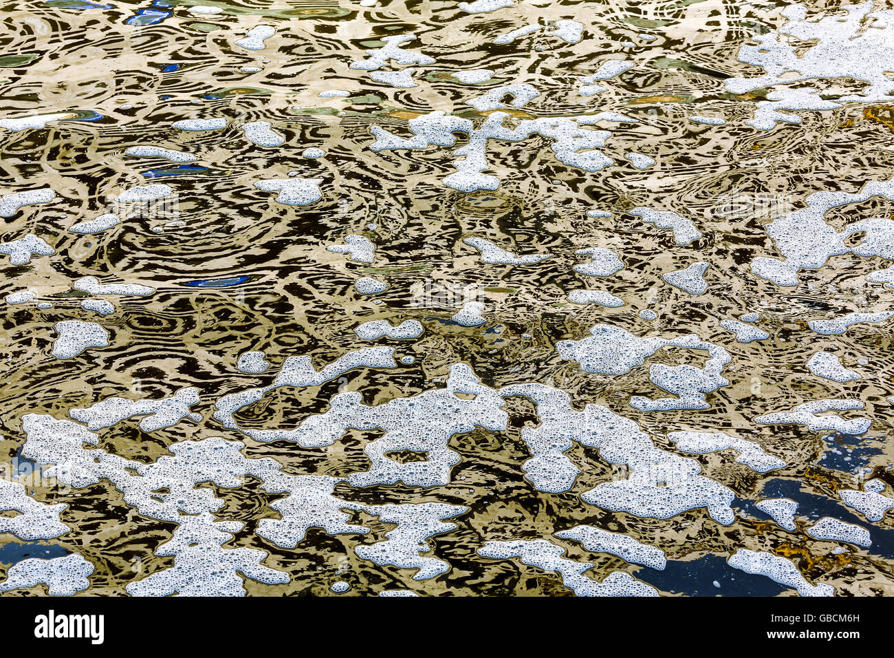 Scum bubbles floating on polluted water surface Stock Photo - Alamy
