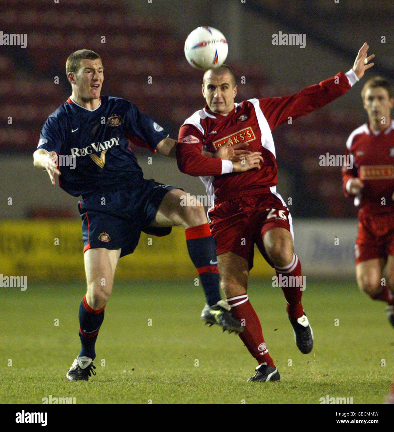 Walsall's Paul Ritchie and Sunderland's Kevin Kyle battle for the ball ...