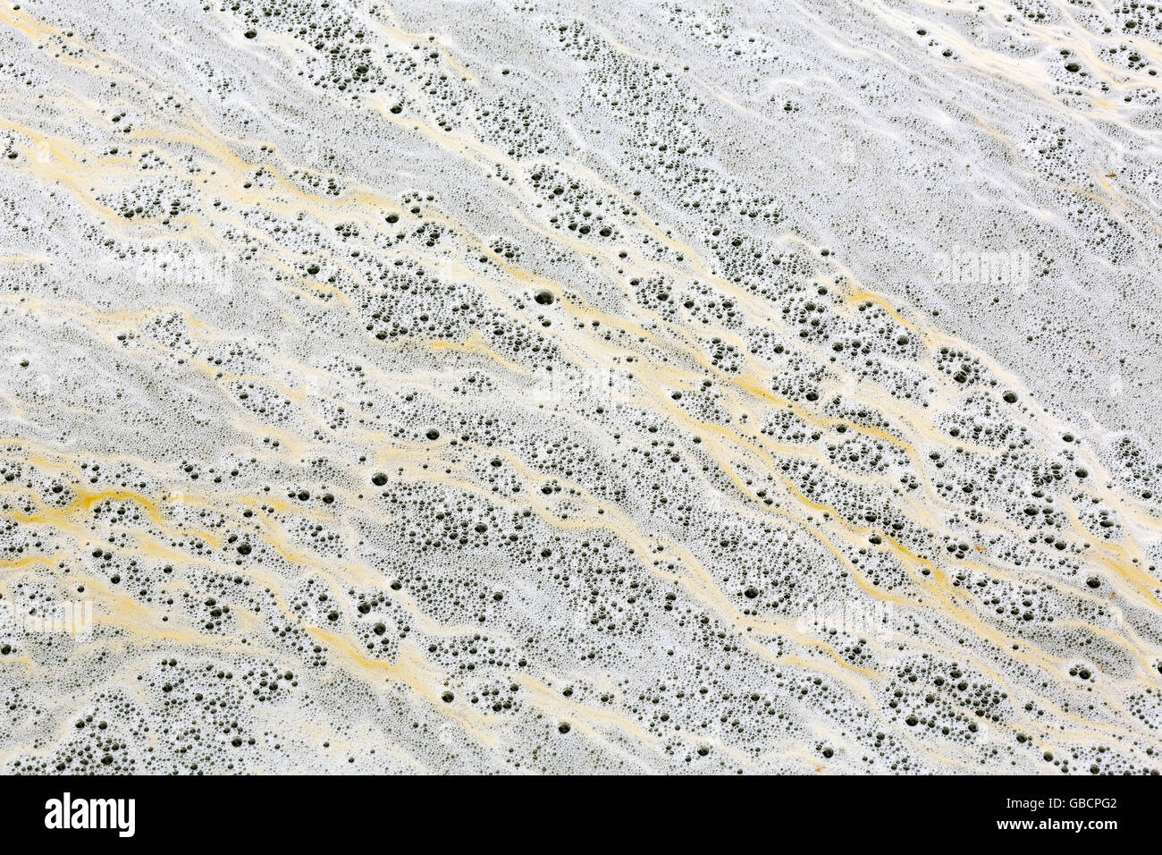Scum bubbles floating on polluted water surface Stock Photo - Alamy