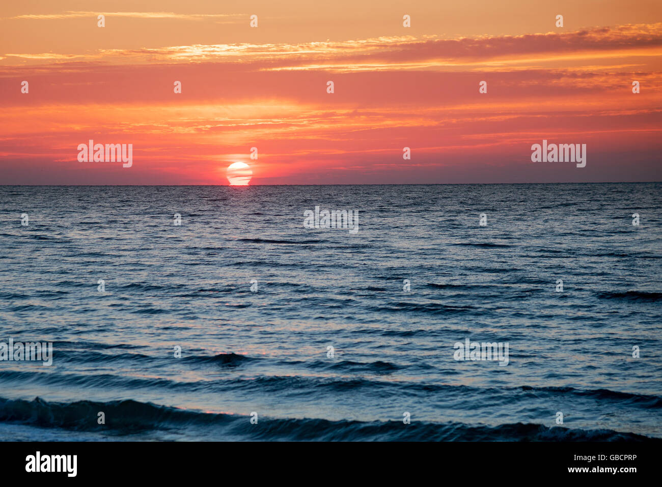 Dawn sunset sea rising sun hi-res stock photography and images - Alamy