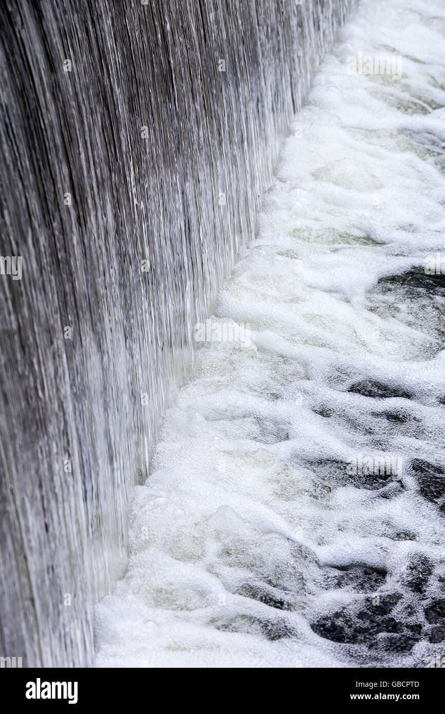Polluted river waterfall with foam bubbles on the surface Stock Photo ...