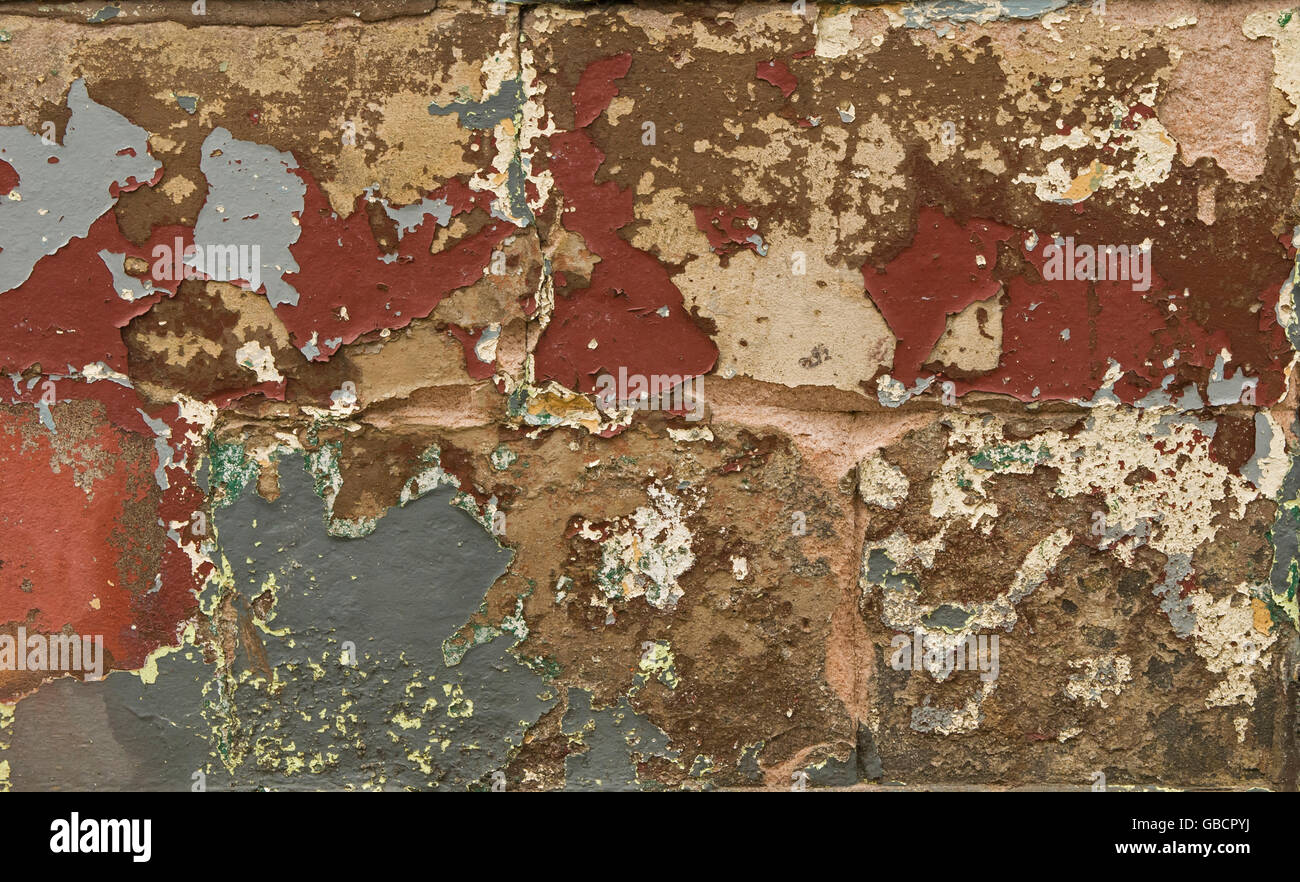 Multi-coloured distressed peeling paint on a derelict wall Stock Photo ...