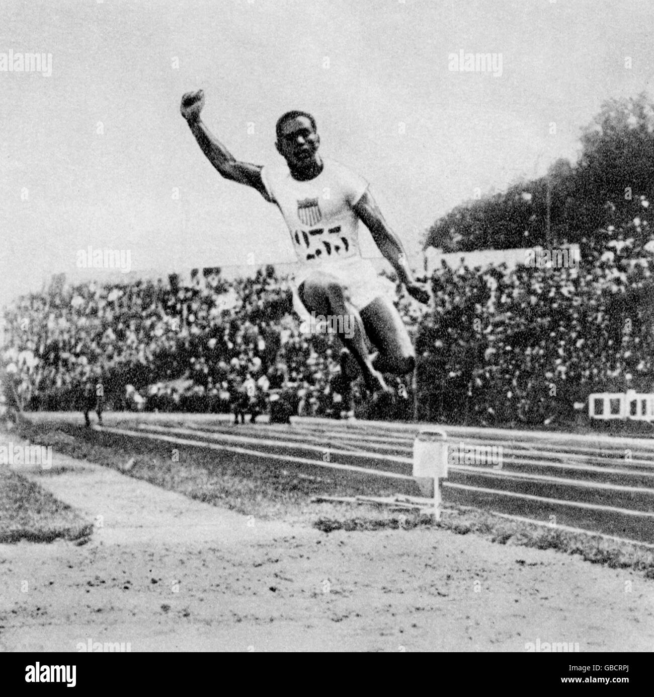 USA's William DeHart Hubbard leaps to a gold medal with a jump of 7.45m ...