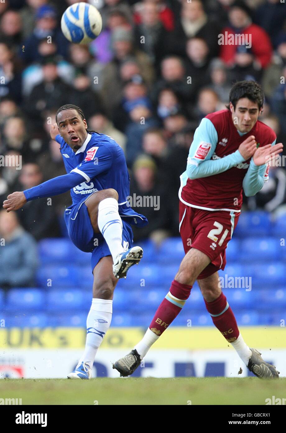 Birmingham City's Cameron Jerome gets a shot away from Burnley's Rhys ...
