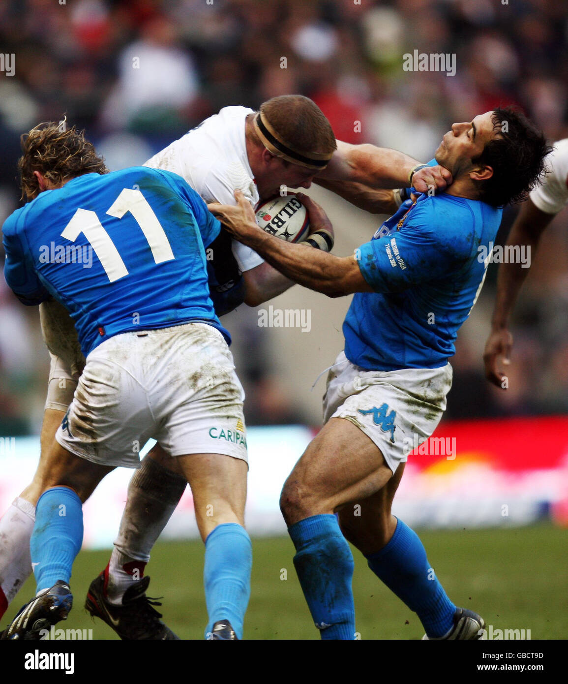 England's Phil Vickery tries to muscle his way through the Italian ...