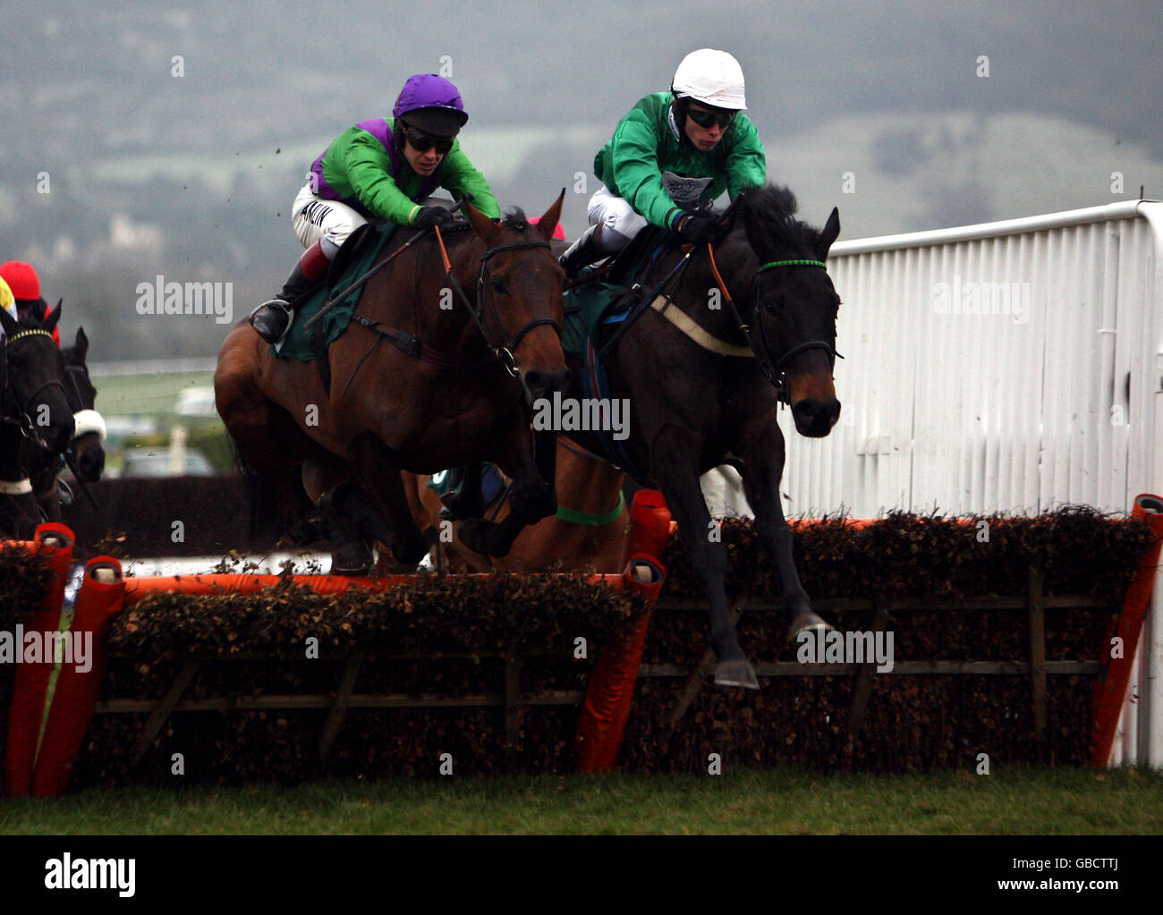 James Reveley on Tazbar (r) and Richard Johnson on Ballydub jump a ...