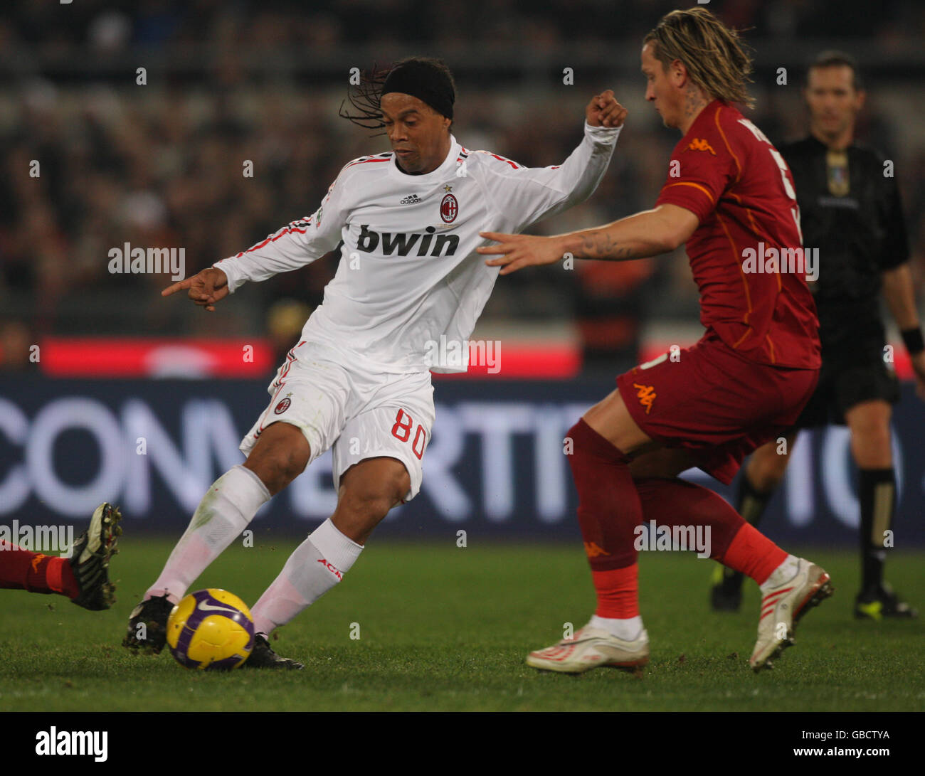 AC Milan's Ronaldinho run is halted by Roma defender Phillipe Mexes at ...