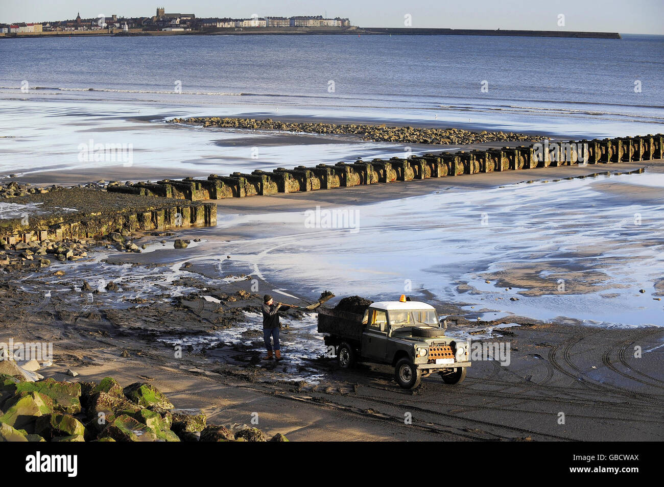 Sea coal digging Stock Photo - Alamy
