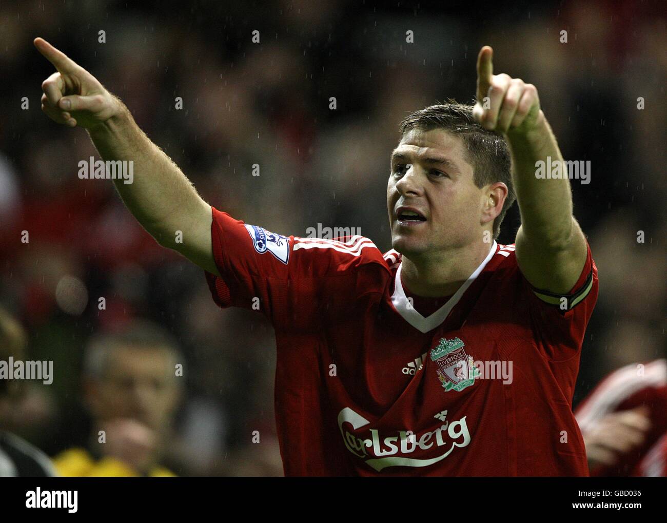 Liverpool's Steven Gerrard salutes the fans as he celebrates scoring ...
