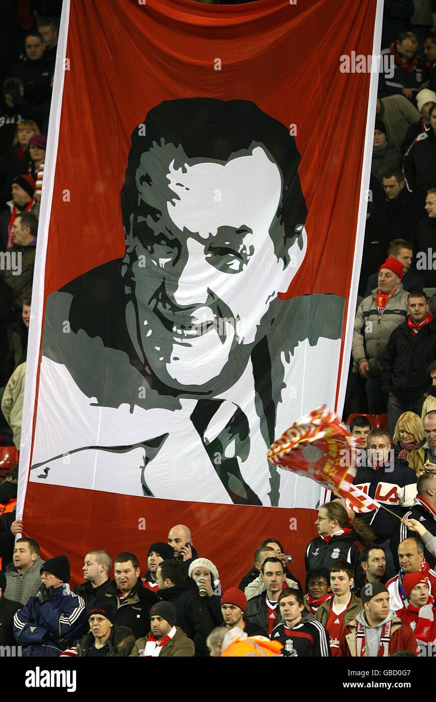 Liverpool fans show their support by waving large flags hi-res stock ...