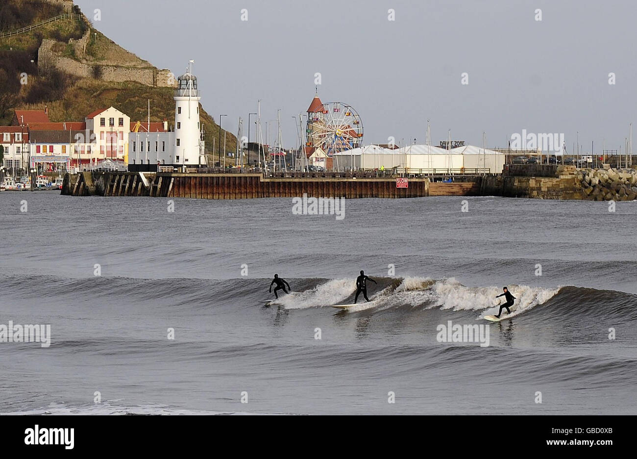 Surfers enjoy storm waves hi-res stock photography and images - Alamy