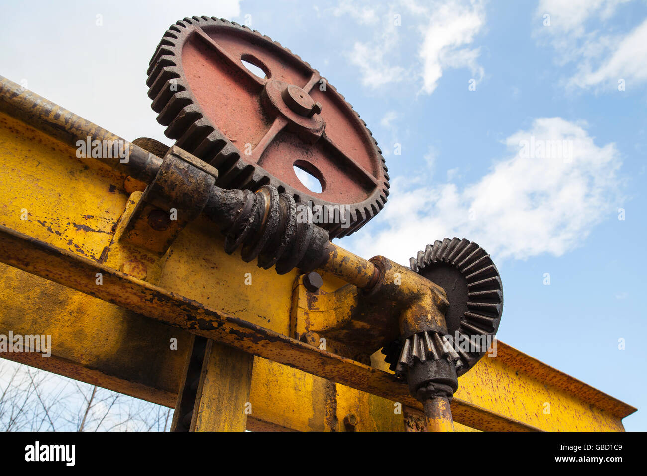 Huge old rusted gears engaged with worm-gear, close up photo with ...
