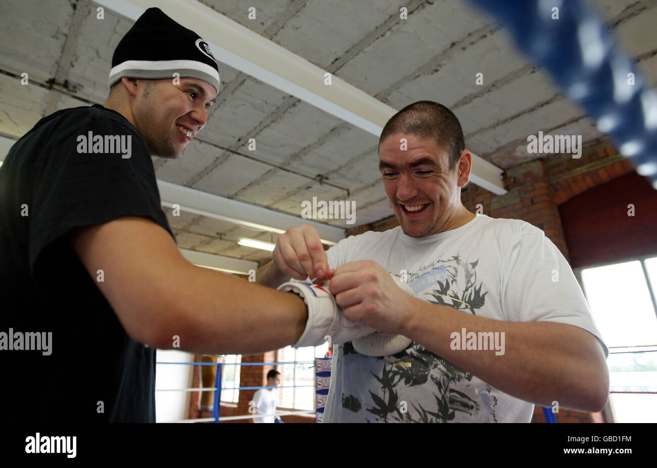 Boxer Tony Bellew enjoys a light moment with trainer Anthony Farnell ...