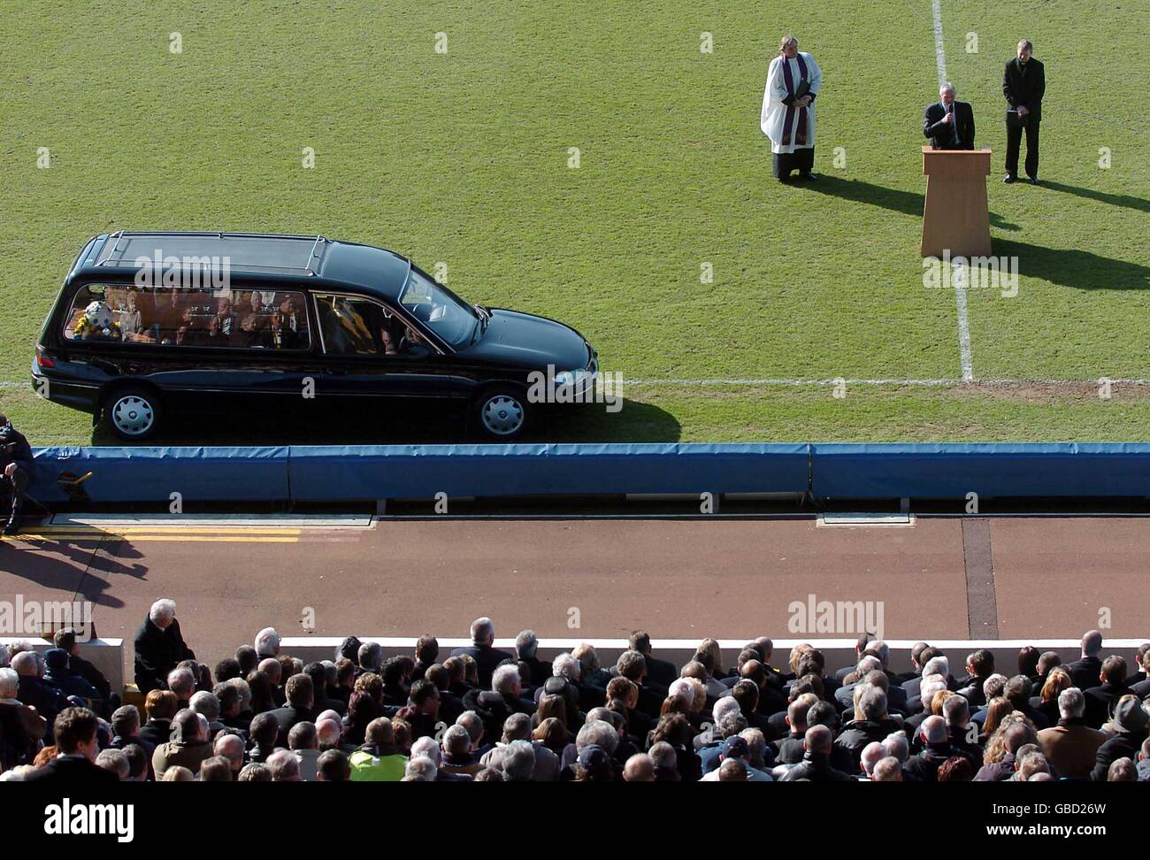 The funeral procession makes its way round the pitch at Elland Road ...