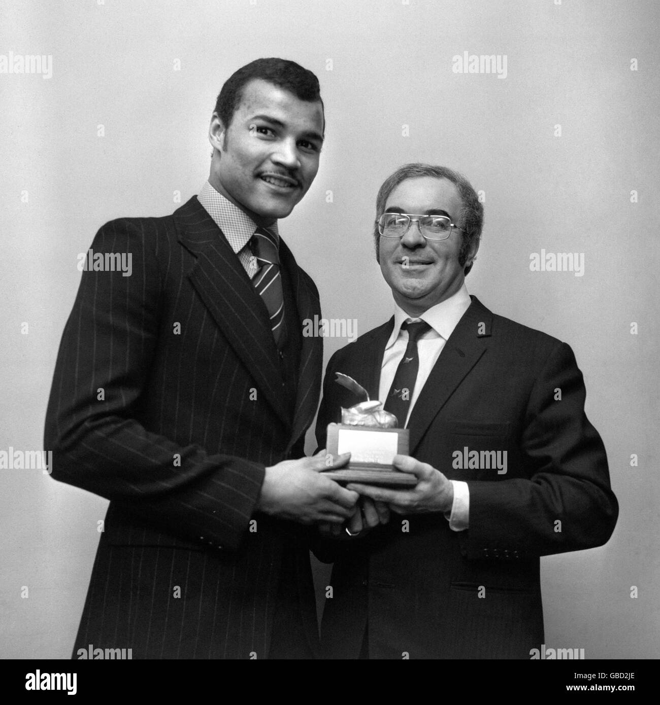 Triple Light-heavyweight champion John Conteh with his award presented ...