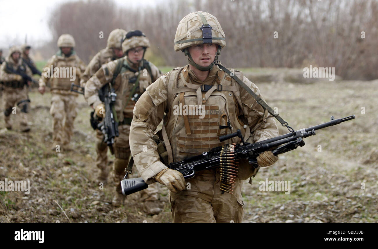 Royal Marines from 45 Commando file along a track during a patrol in ...