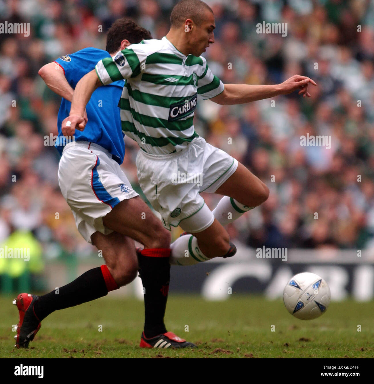 Celtics henrik larsson is tripped by rangers shota arveladze hi-res ...