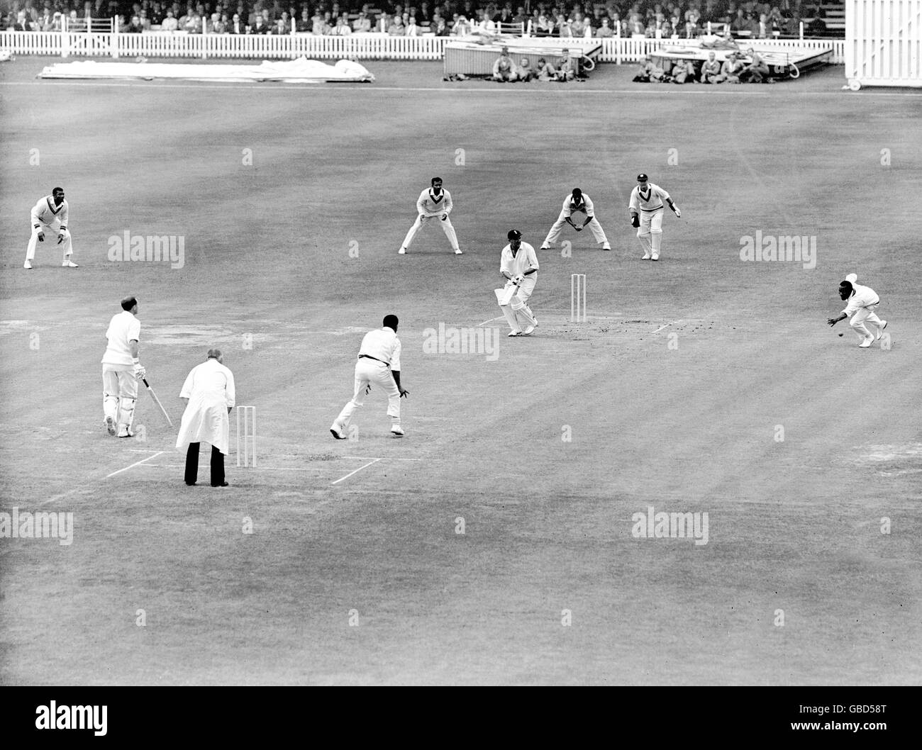 England's Tom Graveney (fourth r) drives a ball from West Indies' Gary ...