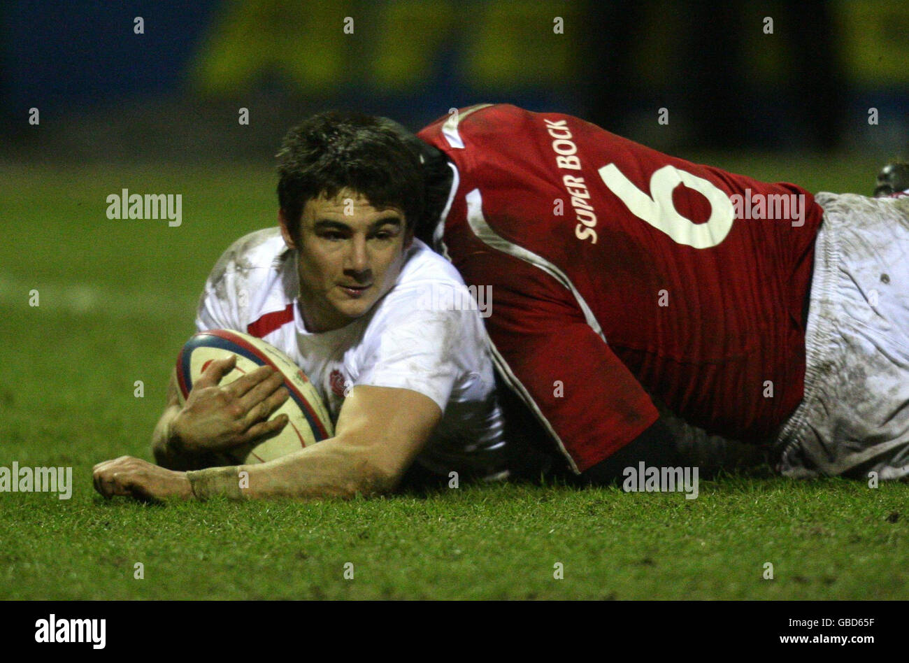 England Saxons' Harry Ellis goes over for a try during the first half ...