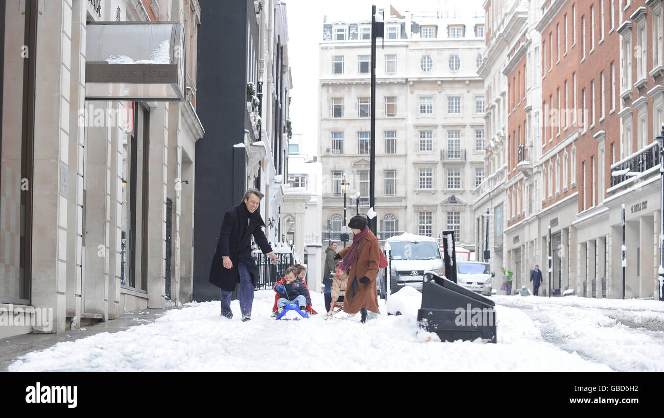 Michael Oke pulls two year old Casper and five year old Clara Grace Oke ...