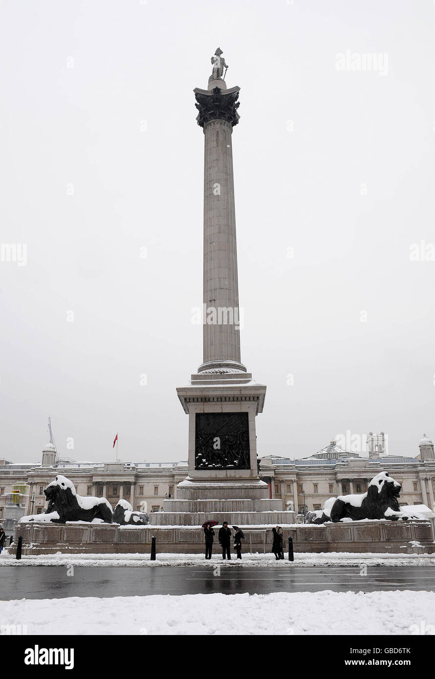 Snow surrounds Nelson's Column, Trafalgar Square, as wintry conditions ...