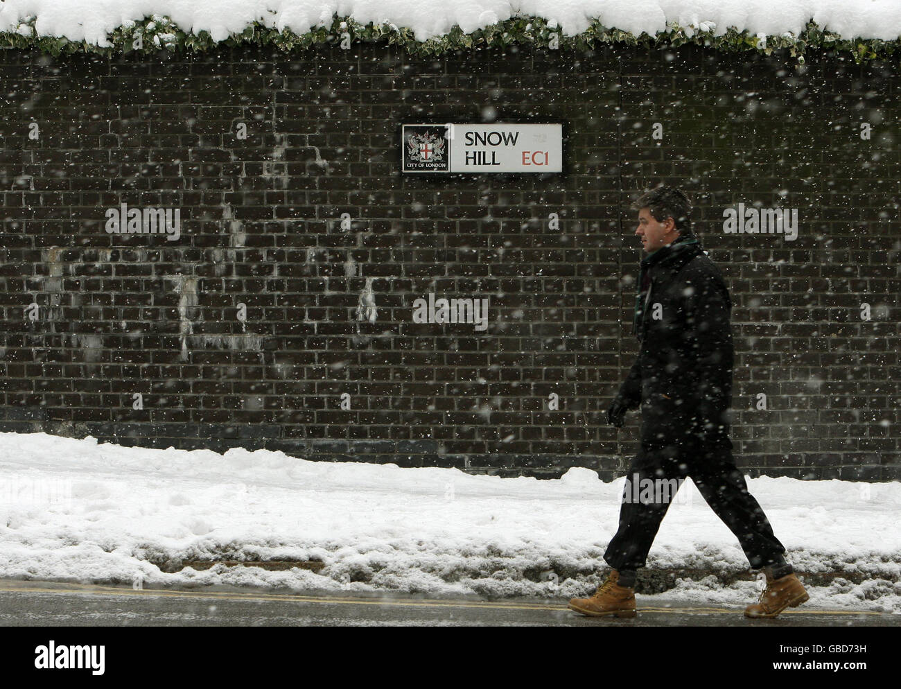Man walks on snow covered hi-res stock photography and images - Alamy