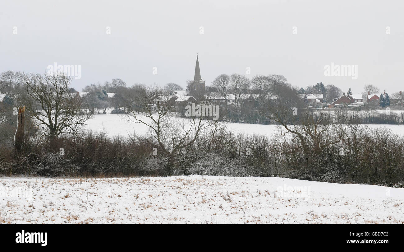 Houghton church can be seen on the horizon across snow covered fields ...