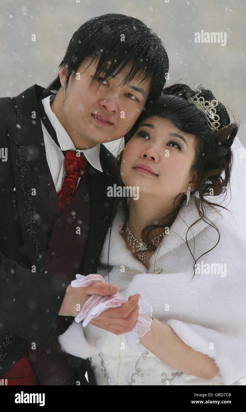 Celebrate their marriage as the snow falls in parliament square hi-res ...