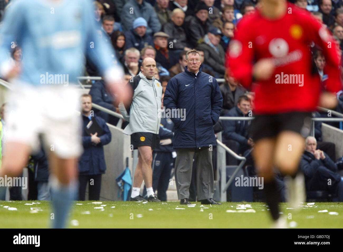 Sir alex ferguson watches the action from the touchline hi-res stock ...