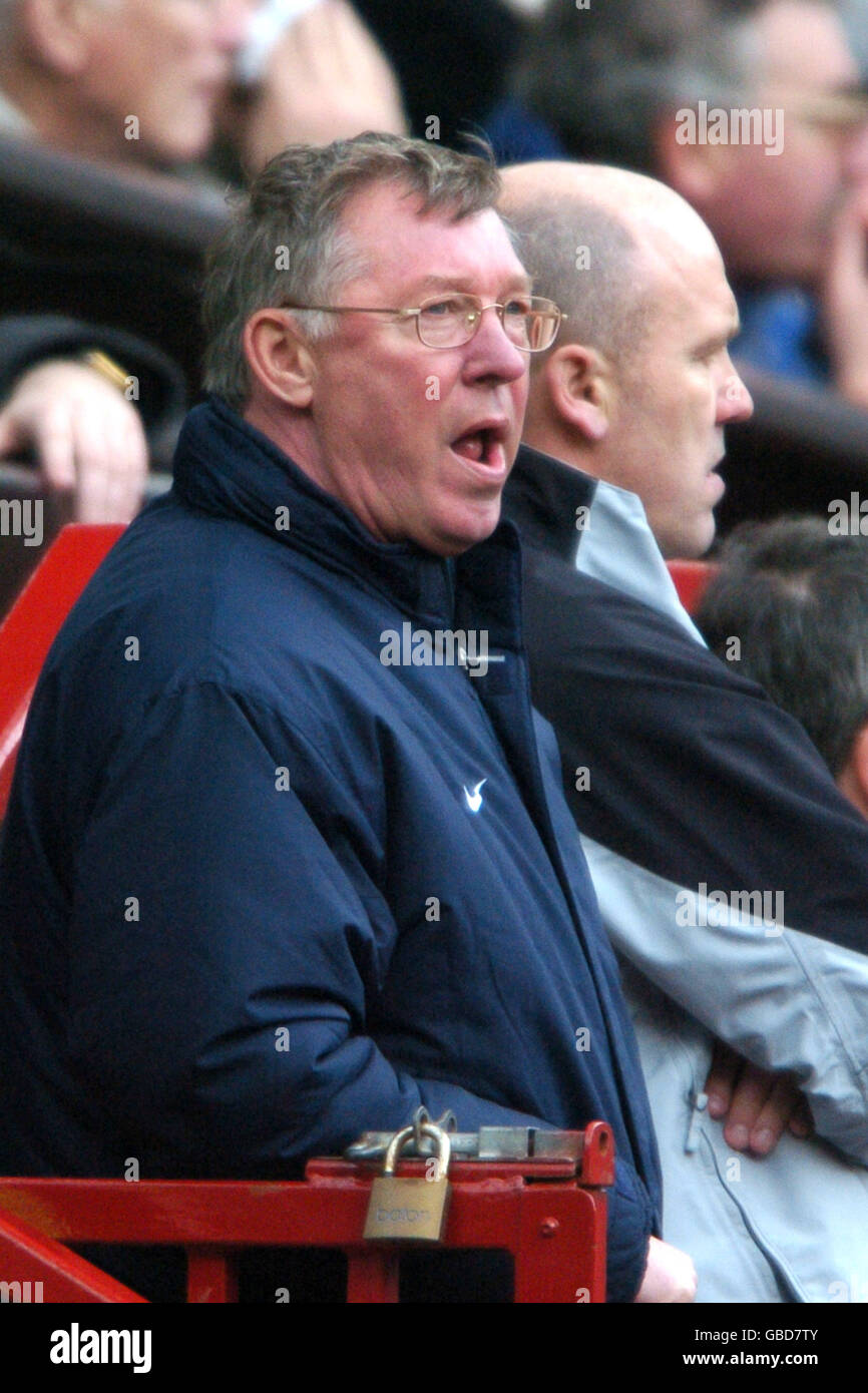 Manchester uniteds manager alex ferguson watches from the bench hi-res ...
