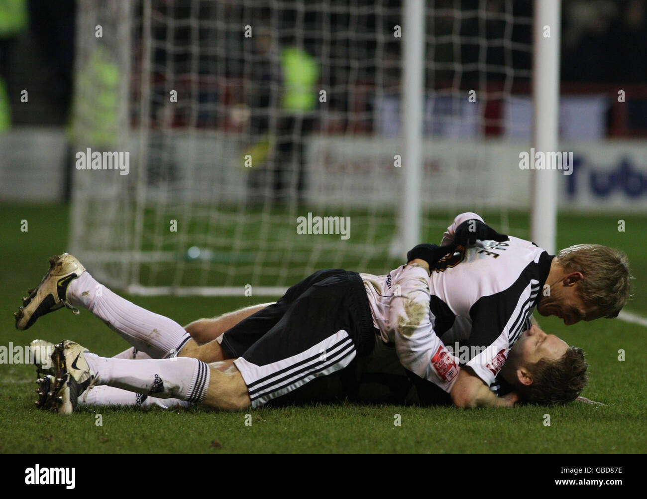 Derby County's Kris Commons celebrates his goal with Gary Teale (top ...