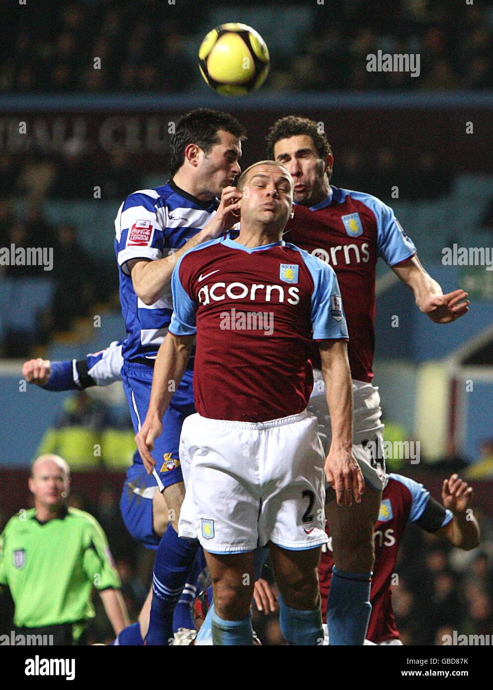 Doncaster Rovers' Sam Hird (left) battles with Aston Villa's Luke Young ...