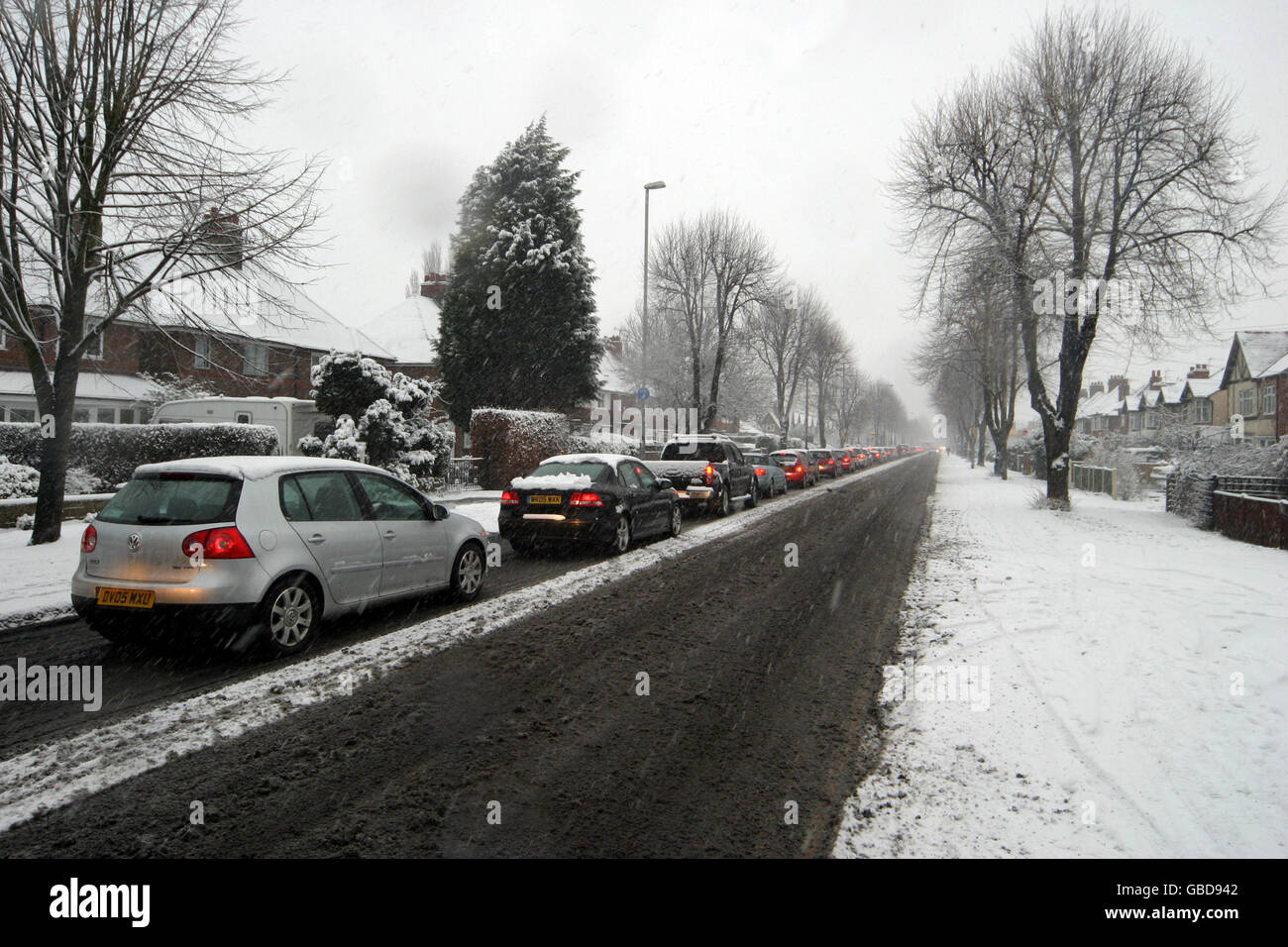 Commuters make their way to work in Chilwell, Nottinghamshire, as heavy ...