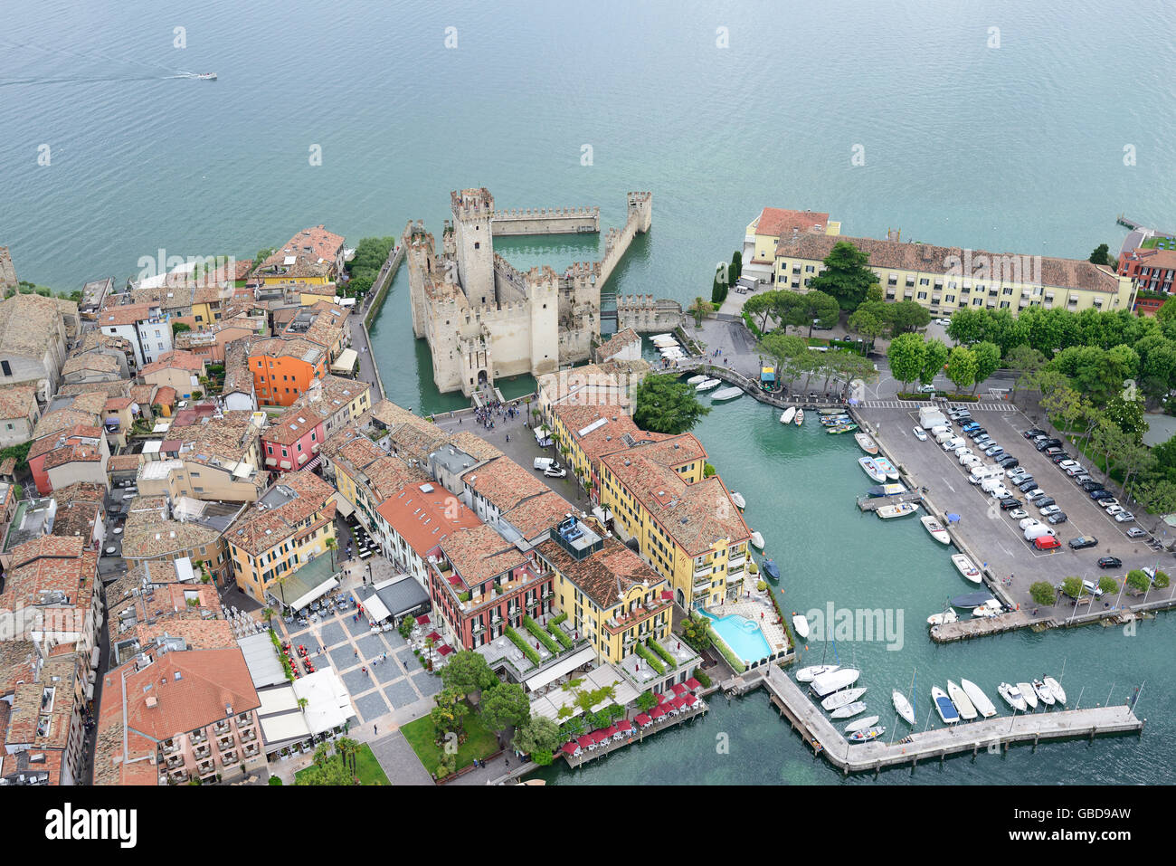 AERIAL VIEW. Medieval castle in a unique "aquatic" setting on the shore ...