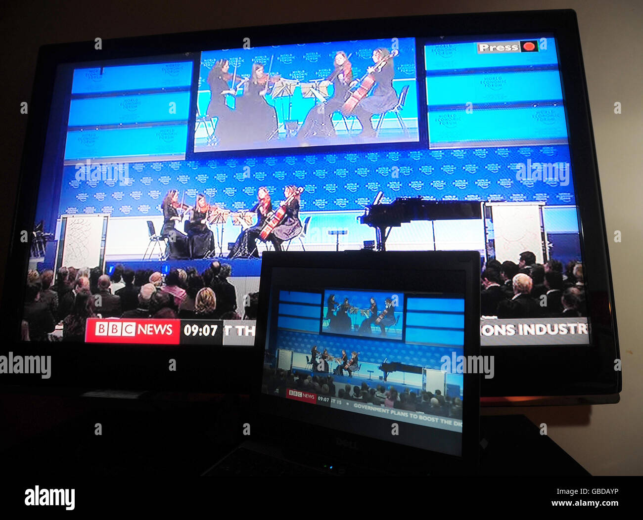 BBC News is viewed on the screens of a laptop computer and a television ...