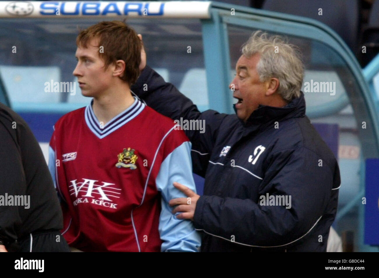 Burnley manager Stan Ternent (r) tries to get the attention of referee ...