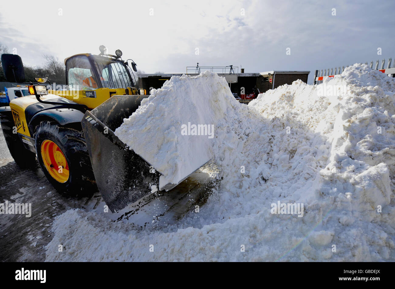 A digger moves a new delivery of salt at the Stroudwater council ...
