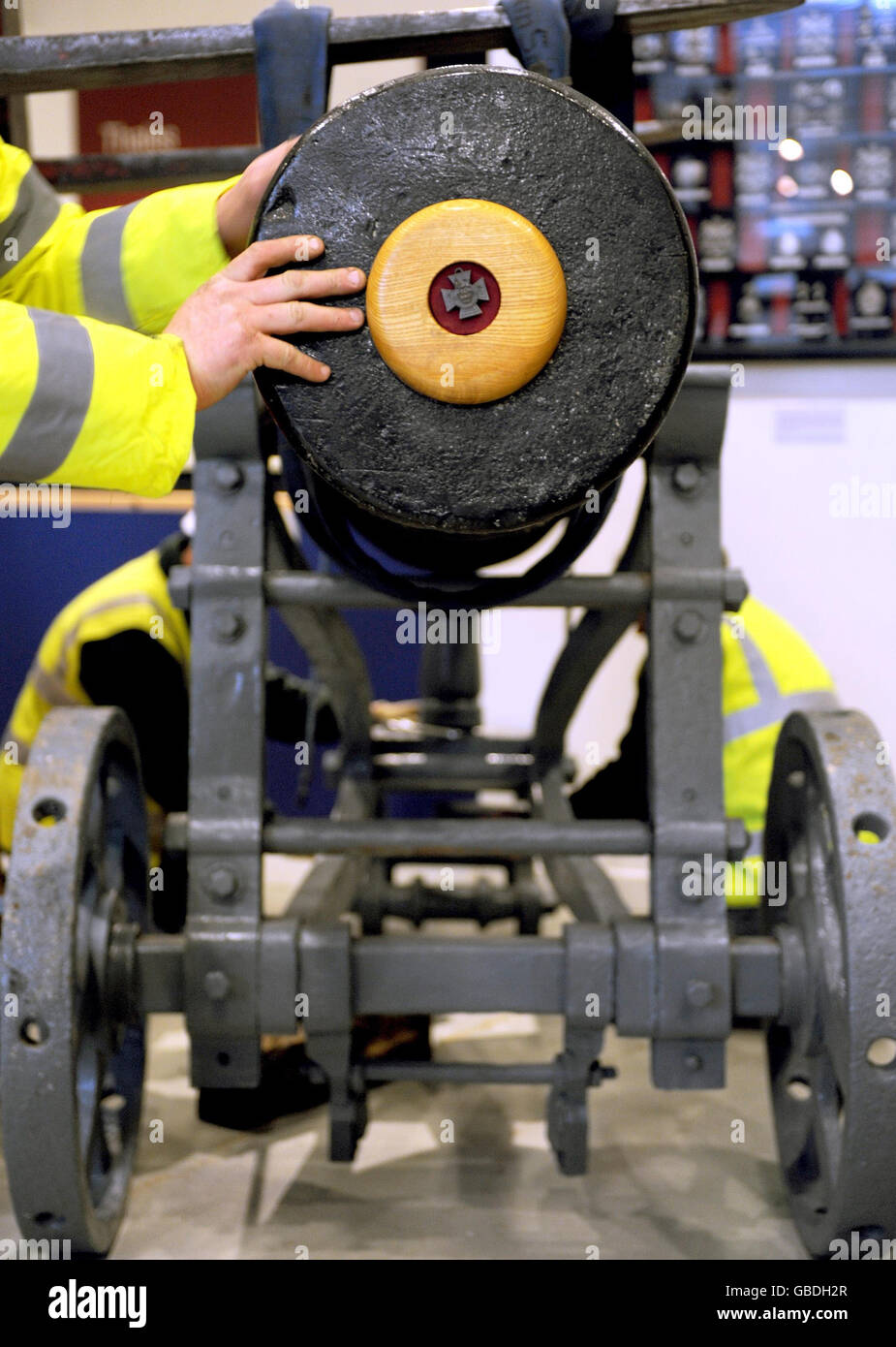 Firepower exhibition. Workers move a cannon from the trophy gallery to ...