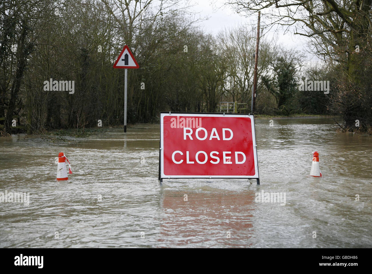 A 'Road Closed' sign stands in flood water on Buttsbury Road ...