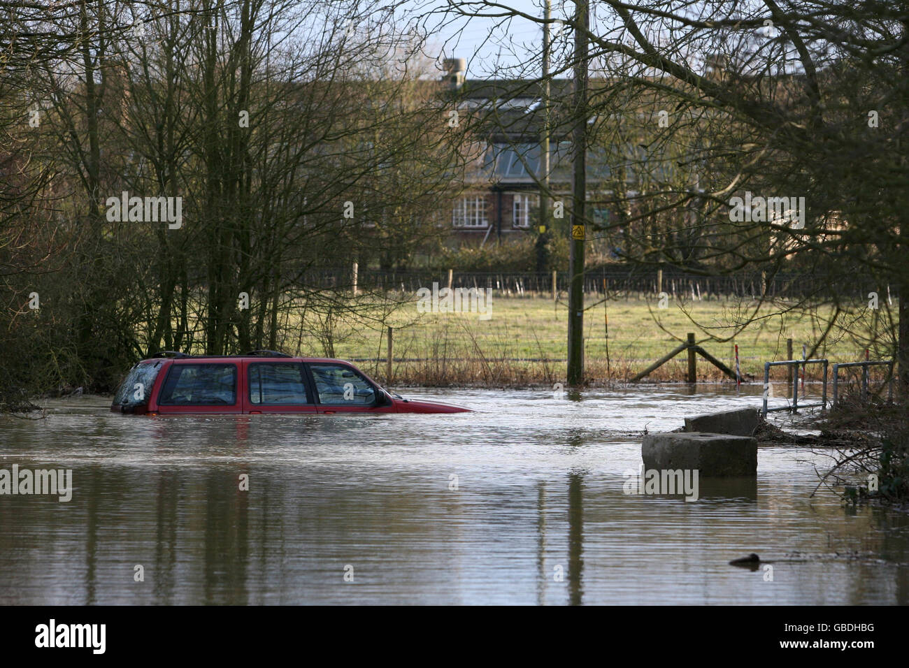 A car is submerged in floods as the River Can bursts its banks near ...