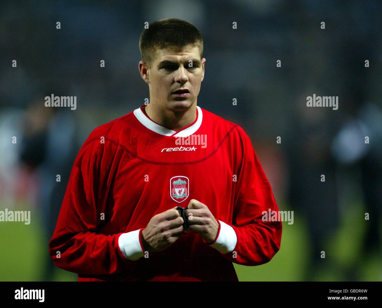 Liverpool's dejected captain Steven Gerrard leaves the field at the end ...