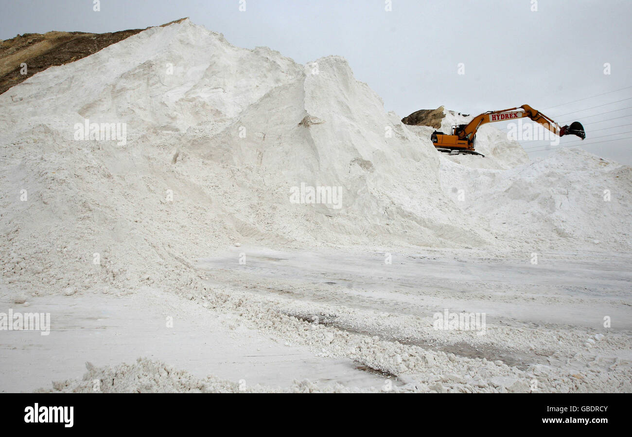 A lone digger prepares low grade salt for wagons to collect from ...